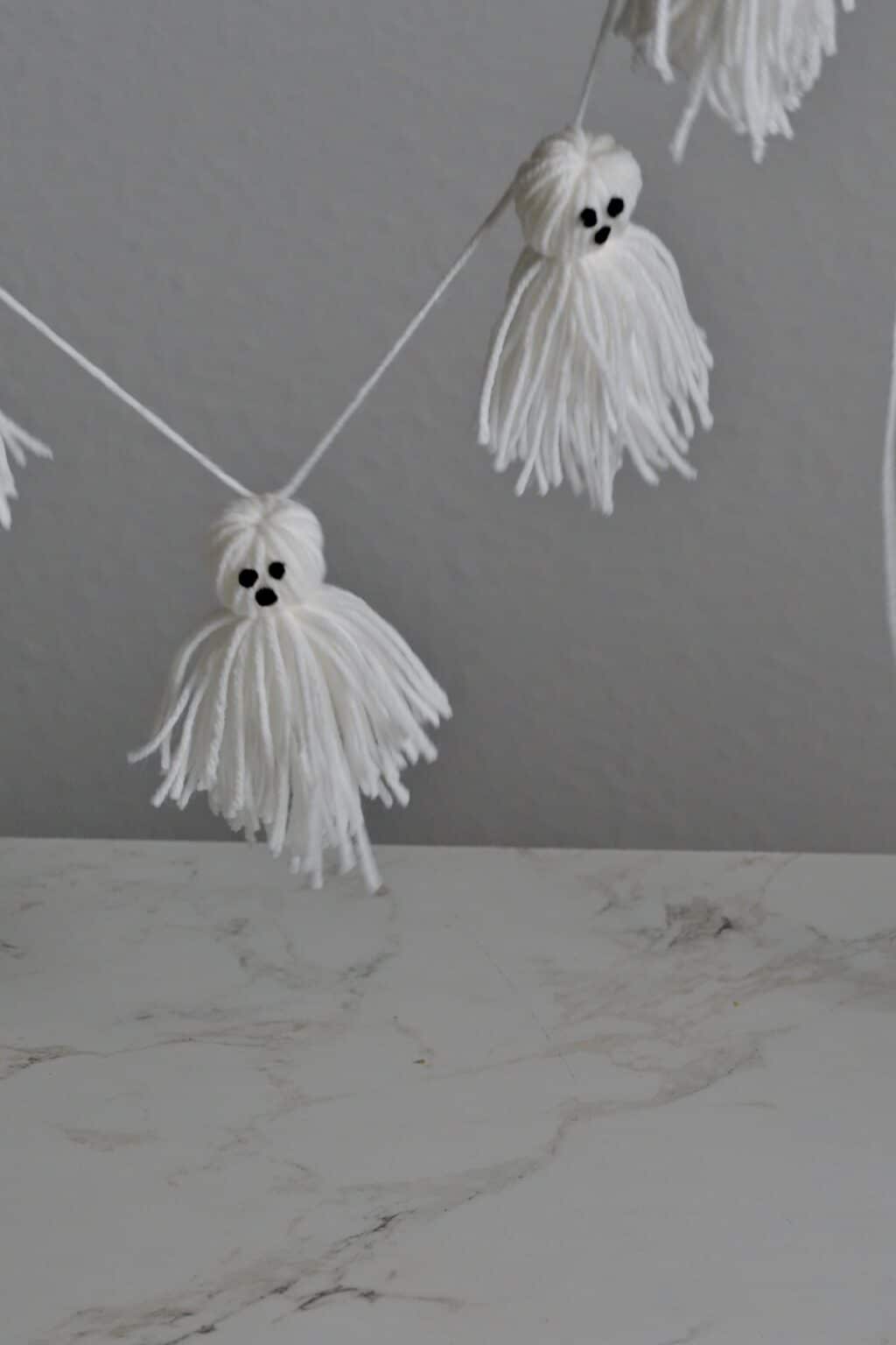 Simple DIY Yarn Ghost Garland - Craft · Share · Play